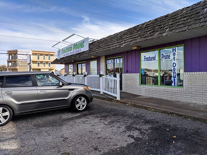 Beach town donut heaven with a quirky name and serious flavor. That white railing might as well be the gateway to paradise.