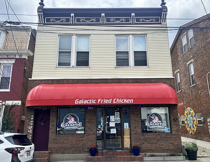 The bright red awning of Galactic Fried Chicken stands out like a delicious beacon on an ordinary street. Extraordinary chicken lives here.