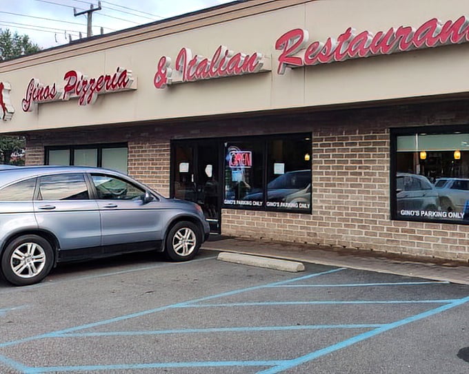 The red script of Gino's sign hints at the classic Italian experience waiting inside. No passport required, just an appetite.