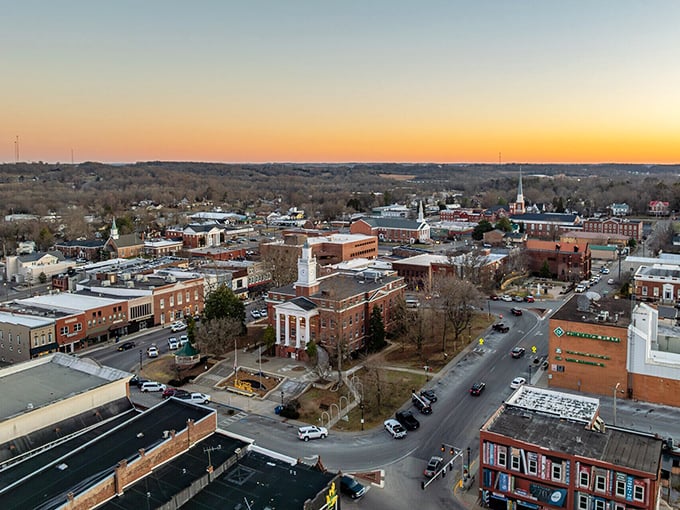 Sunset paints the sky over Glasgow's charming downtown, where time moves at the perfect pace for savoring life.
