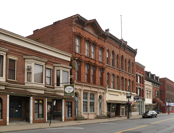 Historic buildings frame Jamestown's streets, where your Social Security check stretches further than your imagination. 