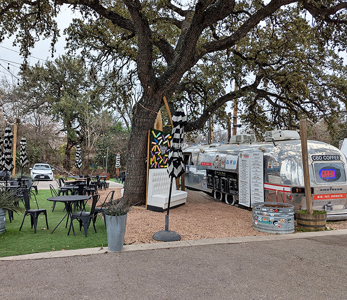 An Airstream trailer under sprawling Texas oaks&mdash;Gourdough's knows the perfect setting makes donuts taste even better. It's not camping; it's glamping for your taste buds.