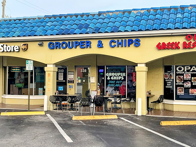 Black metal chairs and palm trees set the stage for grouper sandwich perfection in paradise.