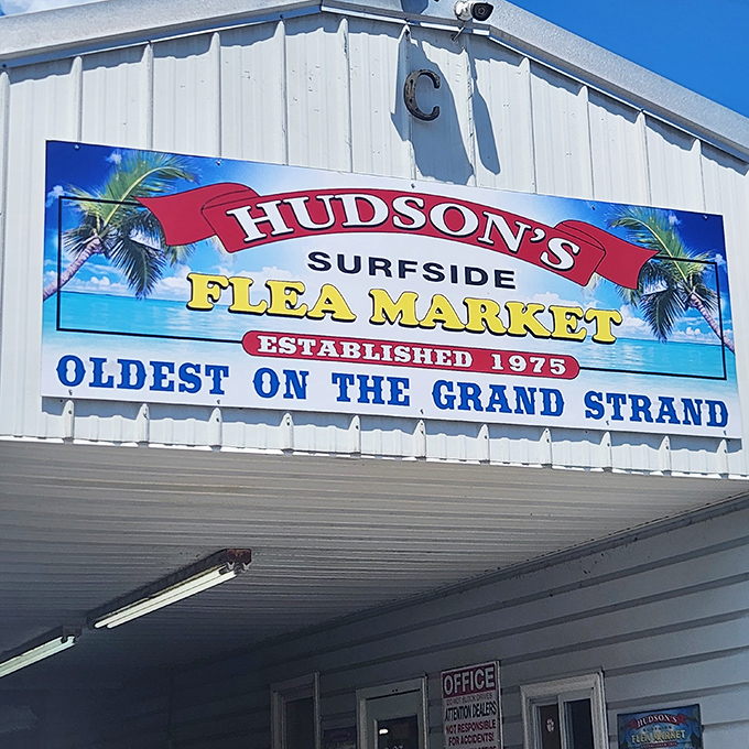 The iconic Hudson's Surfside Flea Market sign promises beach bargains and coastal treasures since 1975.
