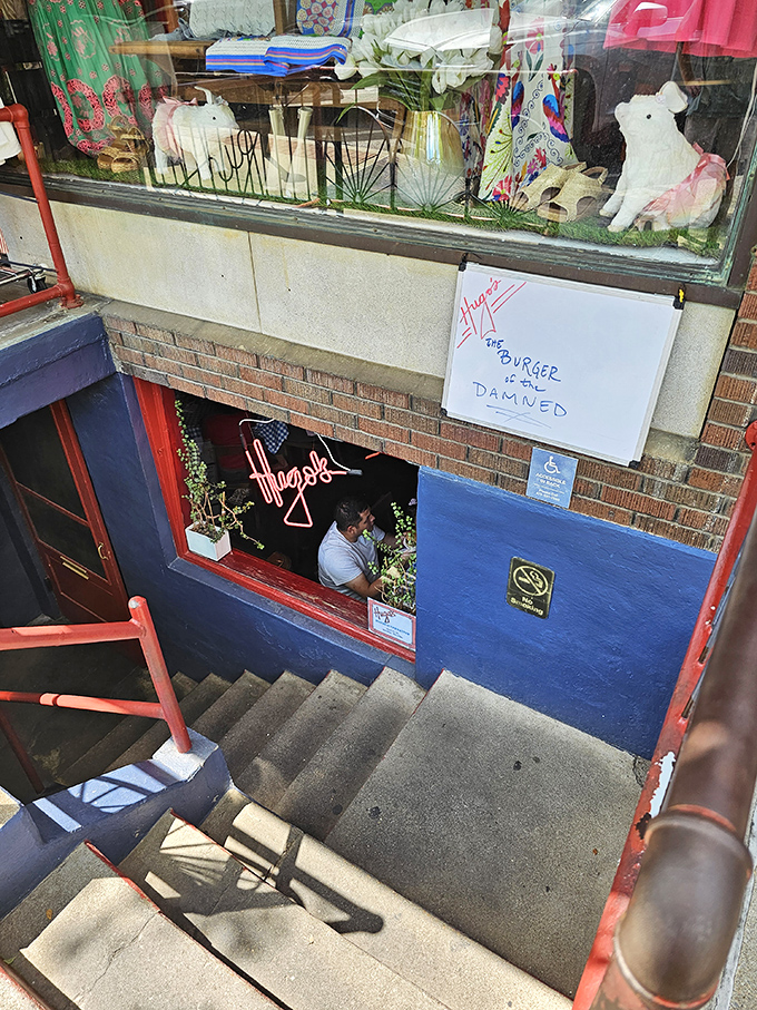 Down these steps lies burger nirvana. Hugo's basement location adds mystery to every bite—like a speakeasy for patty lovers.