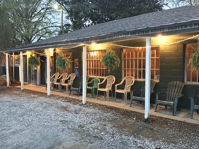 The covered porch and mismatched chairs tell you this place values comfort over fancy decorating.