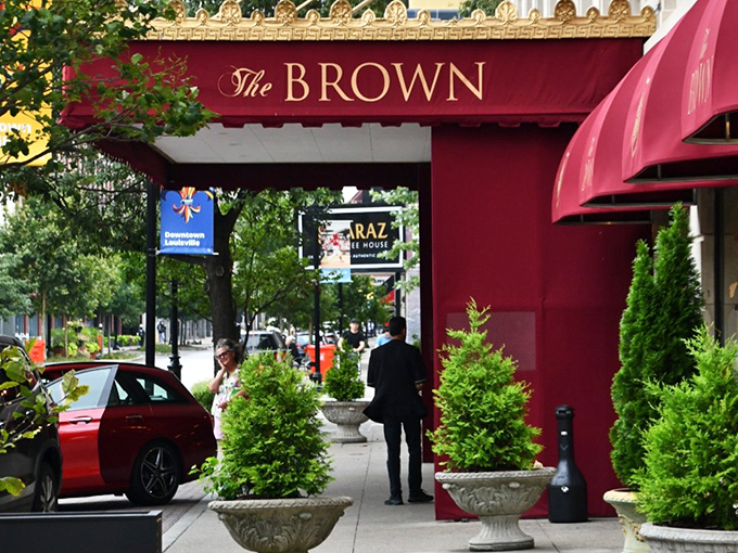Red awnings frame windows that reveal the kind of breakfast magic happening inside daily.