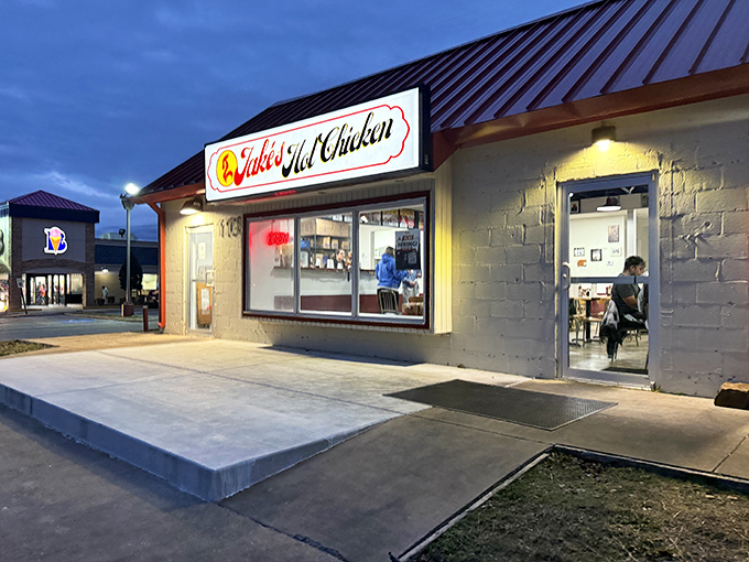 As dusk falls, Jake's Hot Chicken glows like a lighthouse guiding flavor-seekers to their spicy destination.