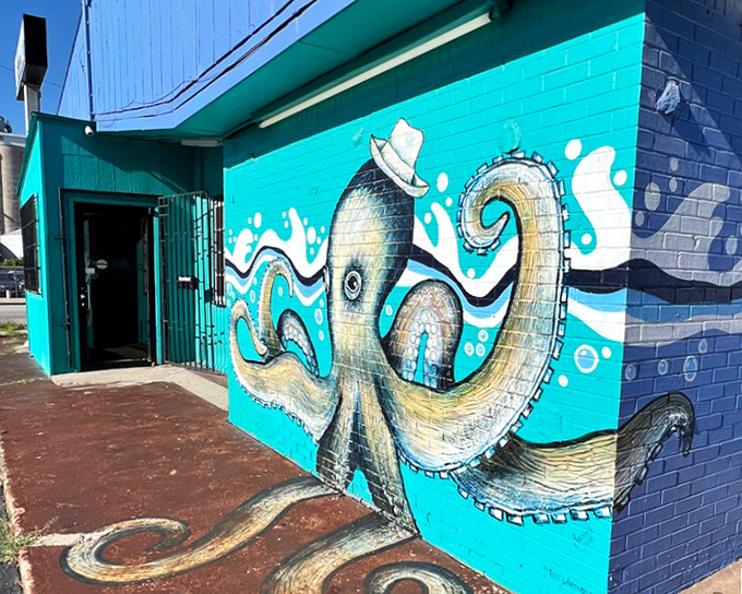 The vibrant octopus mural at Jarocho wraps its artistic tentacles around this bright blue building, signaling seafood adventures await.