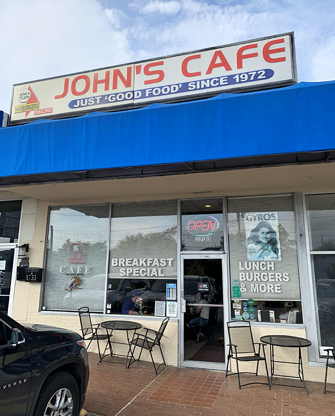 The blue awning of John's Cafe promises simple pleasures &ndash; where "breakfast special" isn't just menu language but a morning philosophy.
