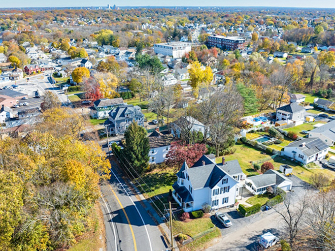 Autumn's paintbrush transforms Johnston into a patchwork quilt of suburban life, where leaf-peeping becomes an Olympic sport worth gold.