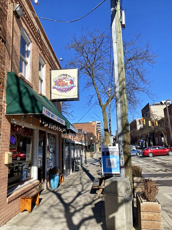 The green awning and vintage charm whisper promises of handcrafted burgers made with genuine love and care.