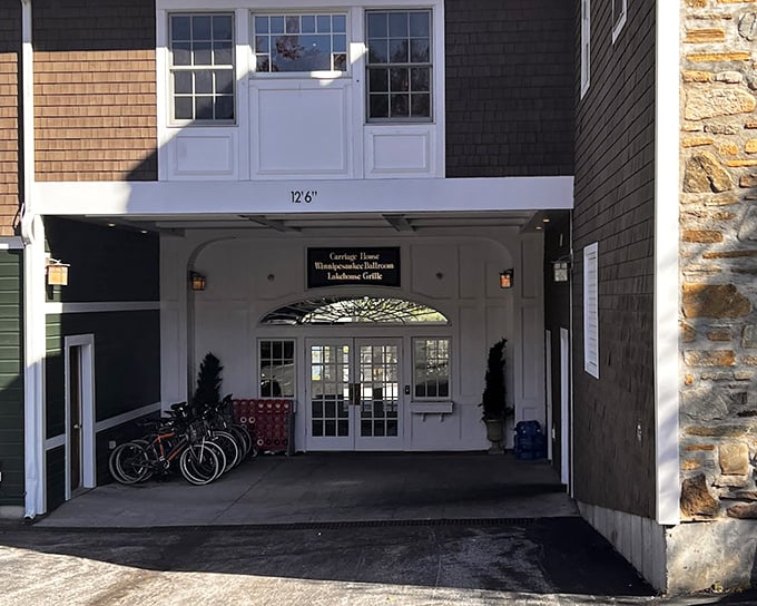 The carriage house entrance leads to culinary treasures, proving good things really do come to those who wander down charming pathways.