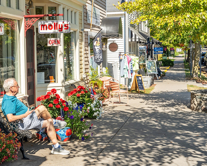 Molly's storefront beckons with the promise of local treasures and conversations that meander like the tree-shaded sidewalks – retail therapy at its most genuine.