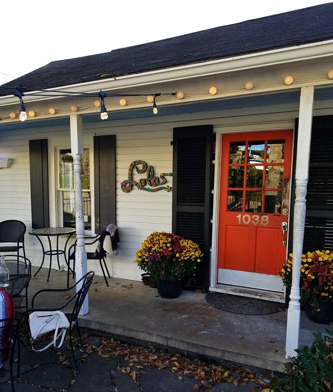 That bright red door isn't just welcoming - it's practically begging you to discover the pizza paradise inside.