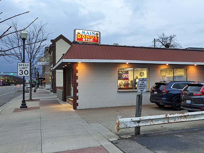 That classic donut shop silhouette against twilight &ndash; Main Donut Shop is Royal Oak's answer to midnight cravings.