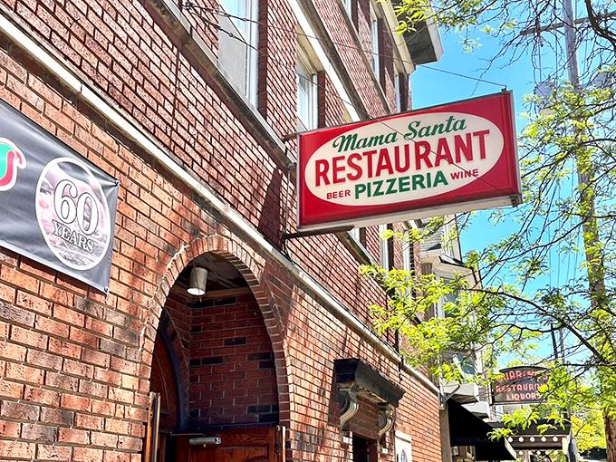 The vintage sign of Mama Santa&rsquo;s Pizzeria has been a Little Italy landmark for decades, inviting locals and visitors alike to taste a slice of Cleveland tradition.