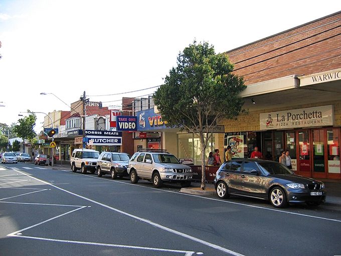 Trees bloom like nature's confetti, celebrating another perfect day in small-town paradise.