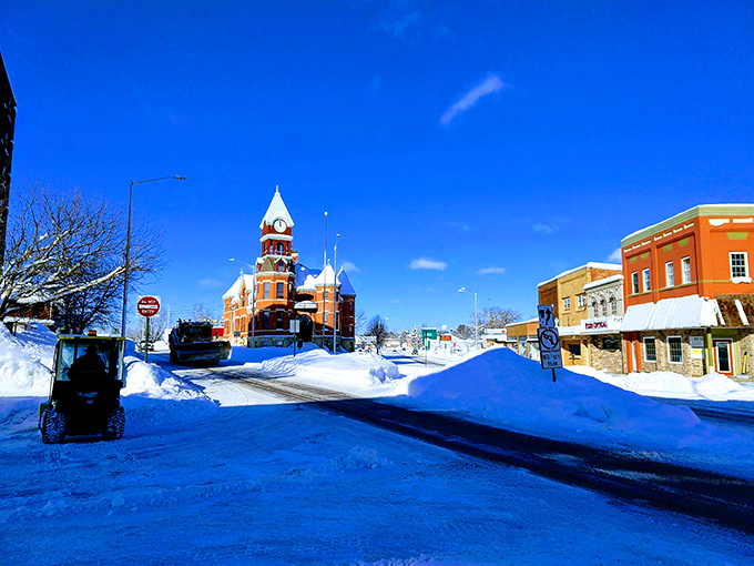 Winter transforms Merrill into a postcard-perfect scene where snow-covered streets lead to warm, welcoming local businesses.