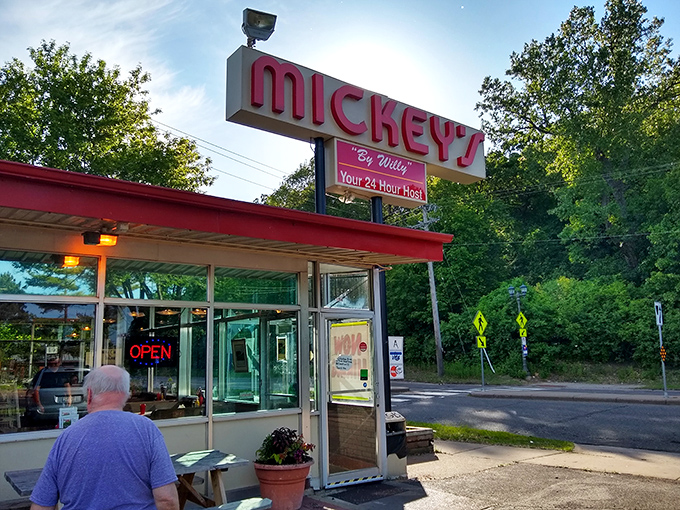 The "Your 24 Hour Host" promise on the sign is the diner equivalent of leaving the porch light on for hungry travelers.