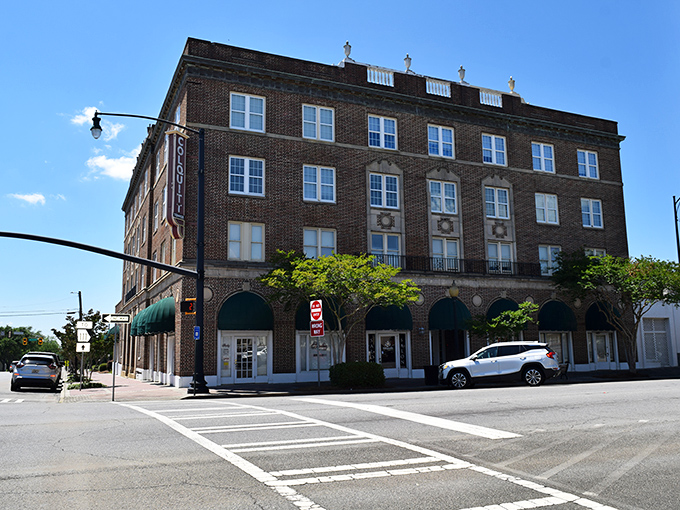 Sunny skies shine over downtown Moultrie where charming brick buildings and leafy streets create a warm and welcoming Southern scene.