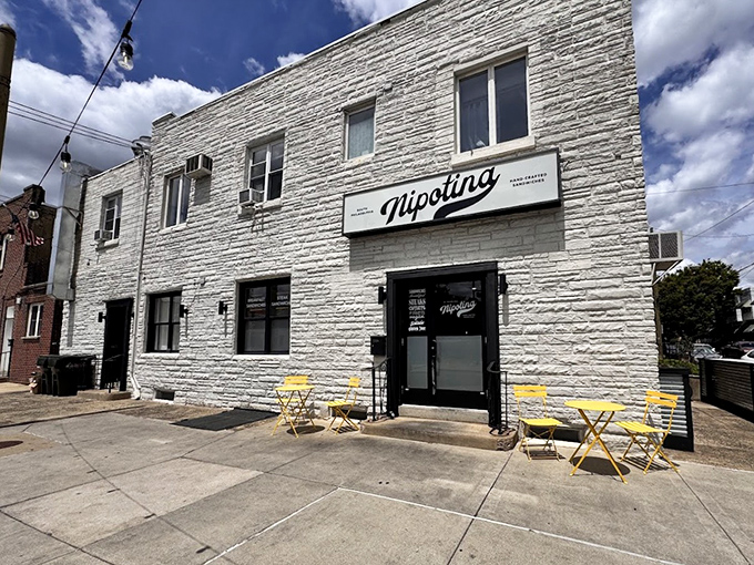 Those yellow chairs aren't just for show. They're front-row seats to one of Philly's newest cheesesteak symphonies.