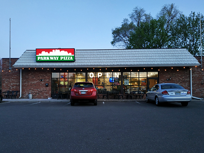 The traffic light says stop, but that Parkway Pizza sign screams "GO!" &ndash; your stomach will thank you later.