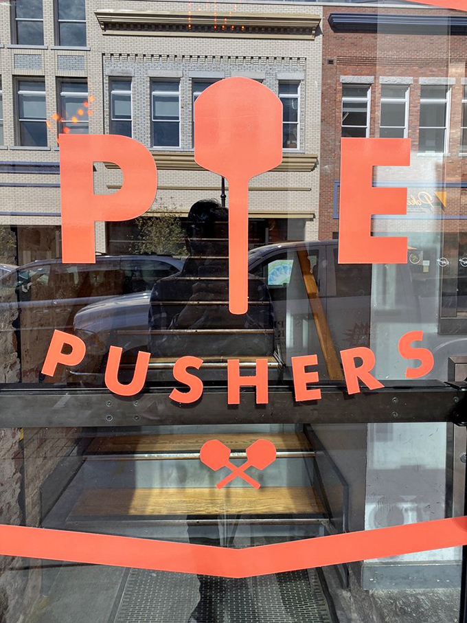 The bold "PIE PUSHERS" lettering says it all &ndash; these folks take their pizza mission seriously. And we're grateful they do!