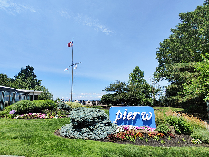 Blue skies, blue waters, and blue umbrellas - Pier W's outdoor seating offers a seafood experience with a view.