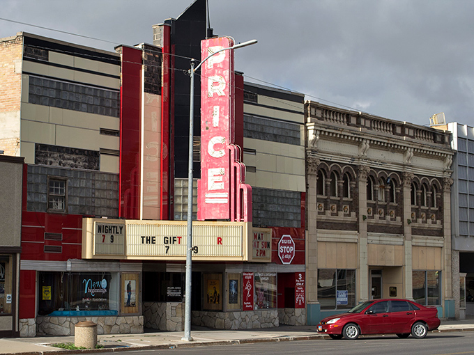 The iconic Price theater marquee stands proud, offering entertainment at prices your grandparents would recognize.