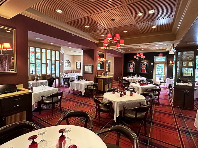 Red lampshades cast a warm glow over Prime 44 West's elegant tables, where every meal feels like a special occasion worth savoring.