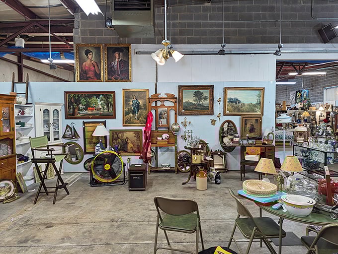 A collector's paradise where vintage portraits watch over antique furniture - like a museum where everything has a price tag.