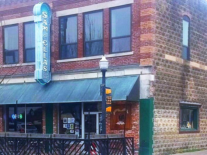 A simple table outside a legendary pizza joint. Sam & Ella's proves great pizza doesn't need fancy frills&mdash;just perfect ingredients and hometown charm.