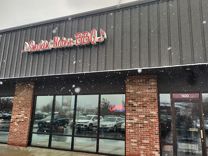 Even in snowy Illinois weather, Smokin' Notes BBQ's glowing sign beckons like a warm, meaty lighthouse for barbecue pilgrims.