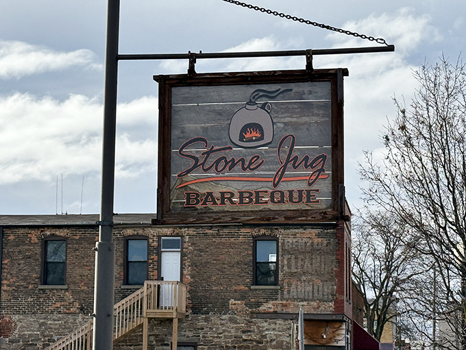 This isn't just a restaurant sign &ndash; it's a wooden beacon of hope for anyone who believes barbecue should be treated as a religious experience.