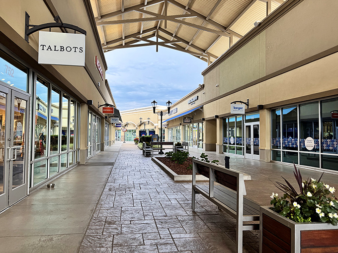 The peaceful walkway between stores offers a moment of shopping zen before your next retail adventure.