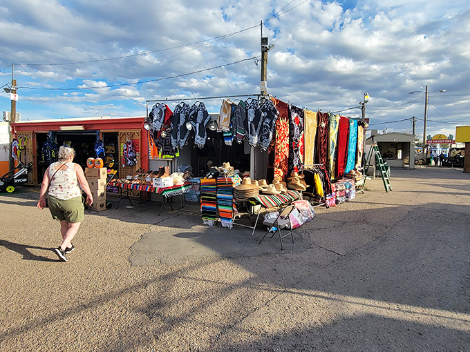 Shopping with a southwestern flair! Colorful blankets and handcrafted items transform this outdoor space into a treasure hunter's paradise.