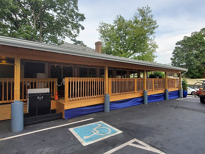 That wraparound porch practically whispers "come sit and stay awhile" to every passing foodie.