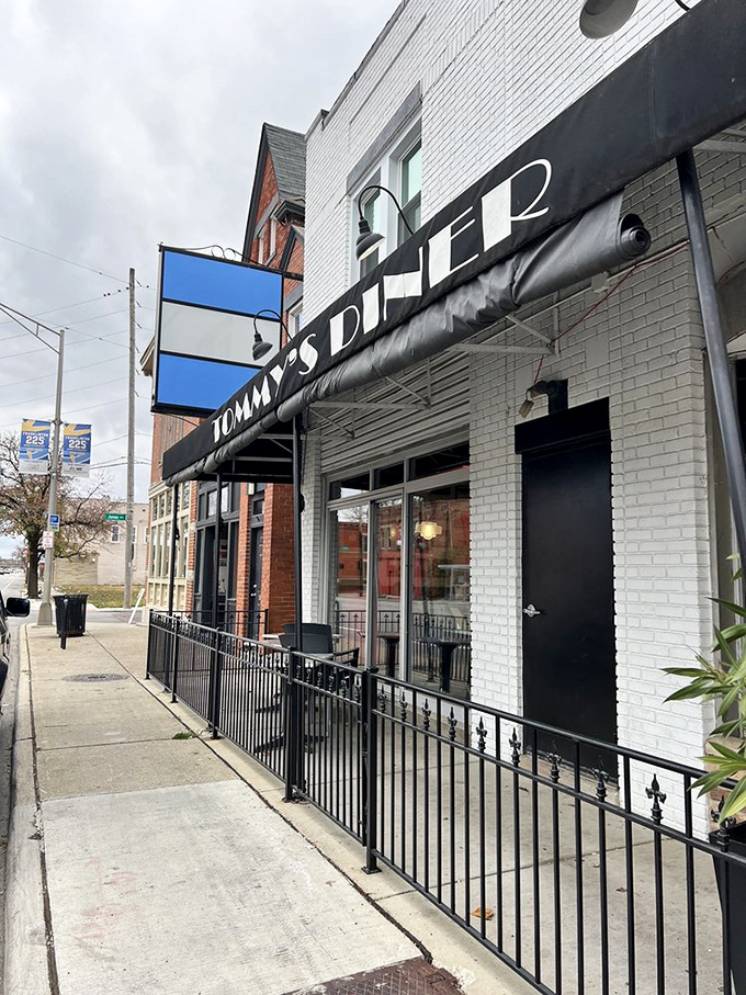 The classic black awning and brick exterior of Tommy's hide a treasure trove of comfort food classics inside.