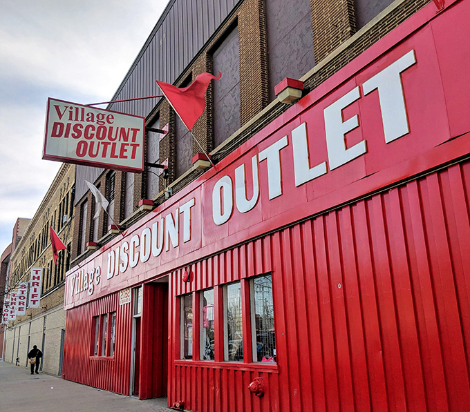 Village Discount's bold storefront design makes thrift shopping feel like entering a carnival of bargains.