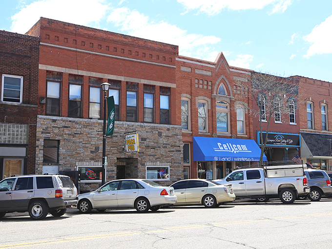 Mixed architectural styles create an authentic streetscape where local businesses thrive without pretentious polish.