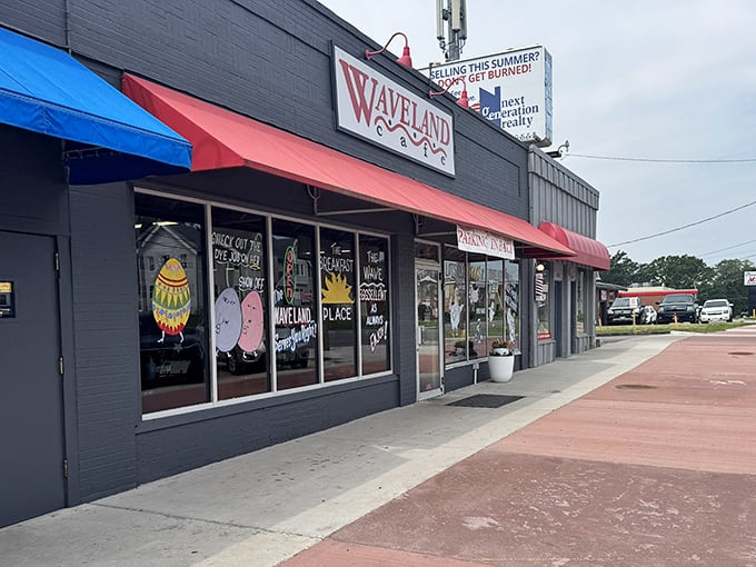 "The Wave" welcomes hungry patrons with cheerful signage and promises of "eggsellent" meals. A neighborhood gem where breakfast dreams come true.
