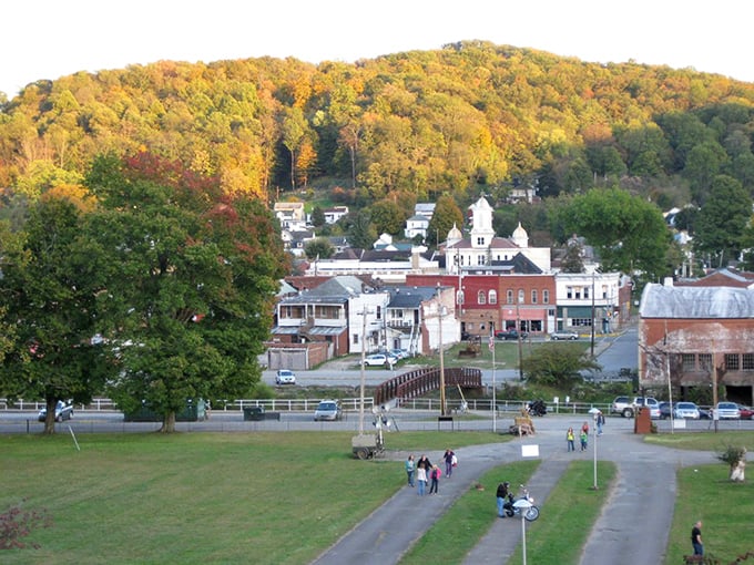 Strollers enjoy Weston's park while autumn paints the hillside&mdash;a scene that would make Bob Ross reach for his happy brushes!