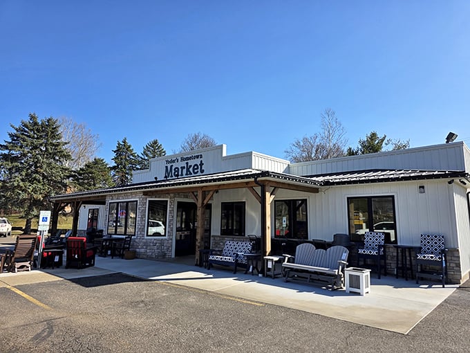 The covered entrance offers a preview of the seasonal treasures waiting inside this beloved Dover destination for Amish goods.