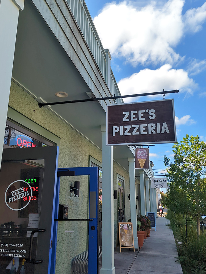 The blue door and hanging sign at Zee's create that perfect "I've discovered something special" moment. Pizza treasures often hide in plain sight.