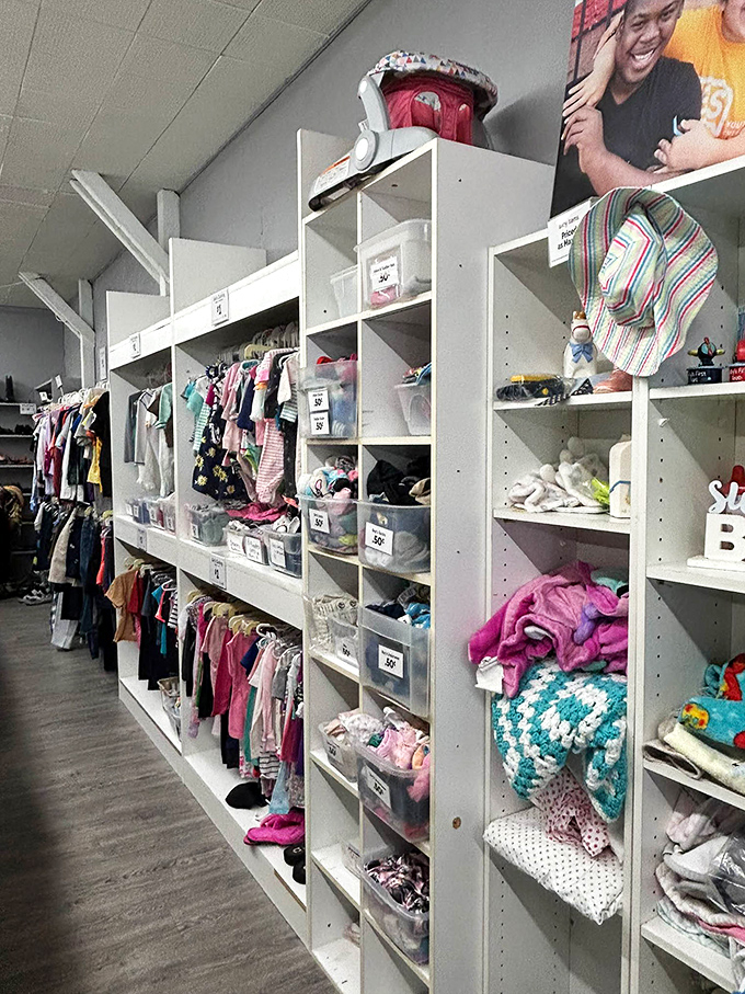 The children's section is meticulously organized, proving that one kid's outgrown wardrobe becomes another family's budget-saving blessing.