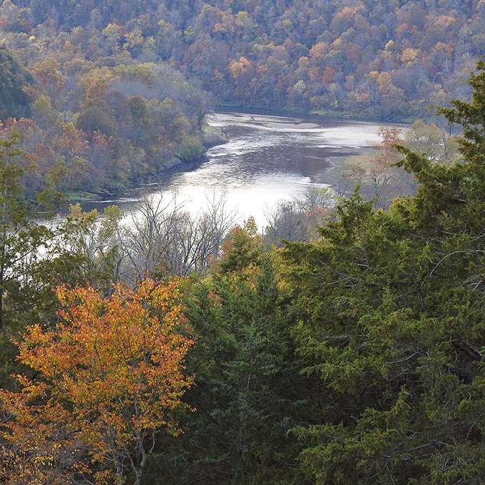 Fall in the Ozarks paints the hillsides in colors that would make a box of crayons jealous. That silver ribbon of water knows it's the real star.