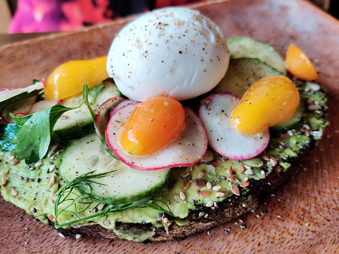 Avocado toast transcending its trendy reputation into something sublime. That poached egg on top isn't just breakfast &ndash; it's edible performance art.