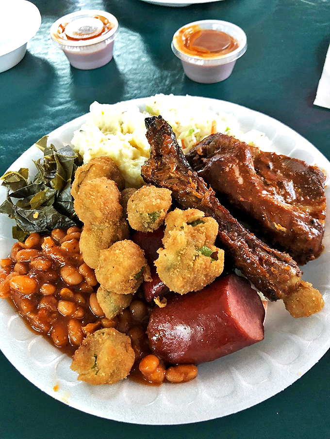 A plate that tells the story of South Carolina in one glorious arrangement. The collards, hushpuppies, and ribs create a holy trinity of Southern comfort.