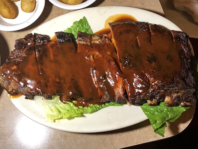 Glistening ribs that would make Fred Flintstone jealous. That sauce doesn't just coat the meat&mdash;it becomes one with it.